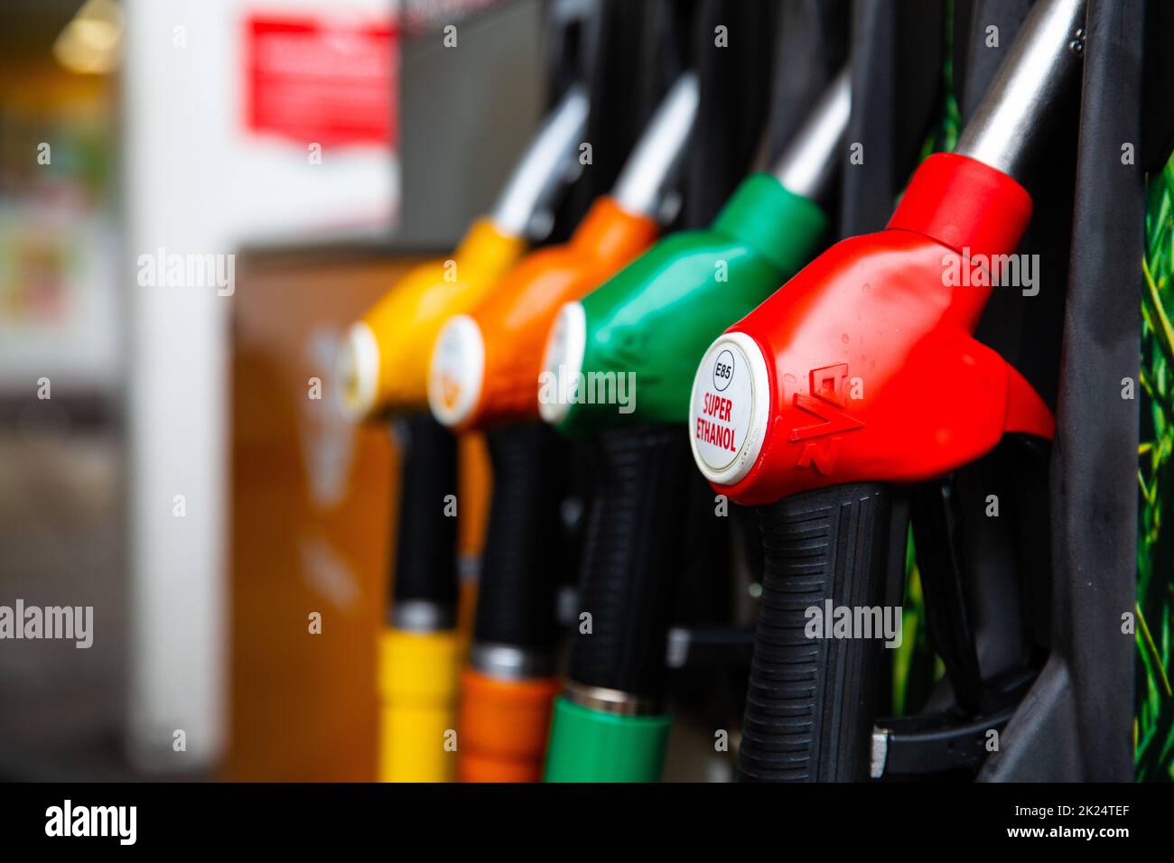 Closeup fueling fuel nozzle car in gas station. gun for refueling. Gas ...
