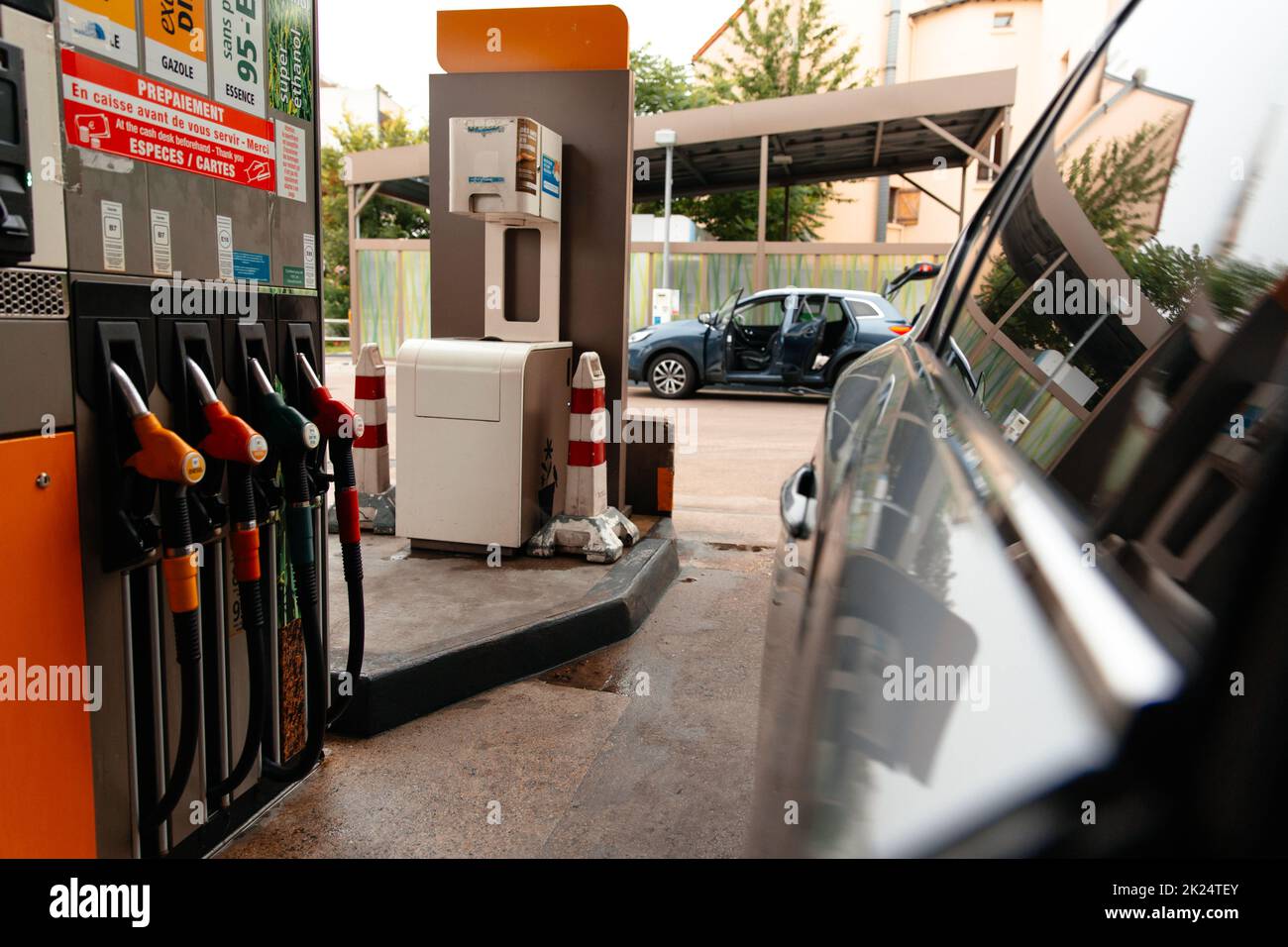Fuel Pumps at the Petrol Station, red and yellow colorful fuel ...