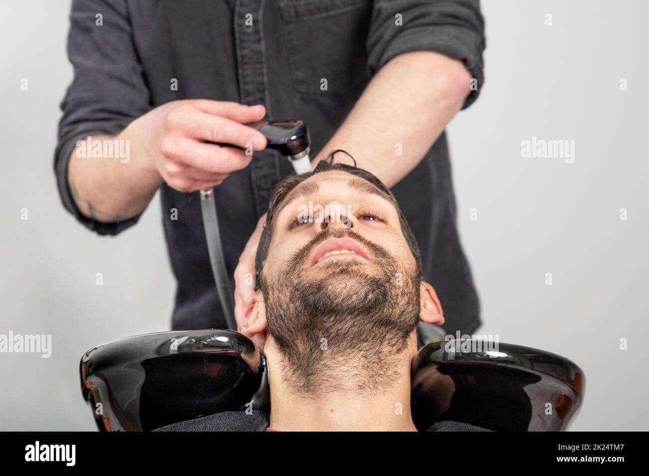 Barber shop hairdresser man washes hi-res stock photography and images ...