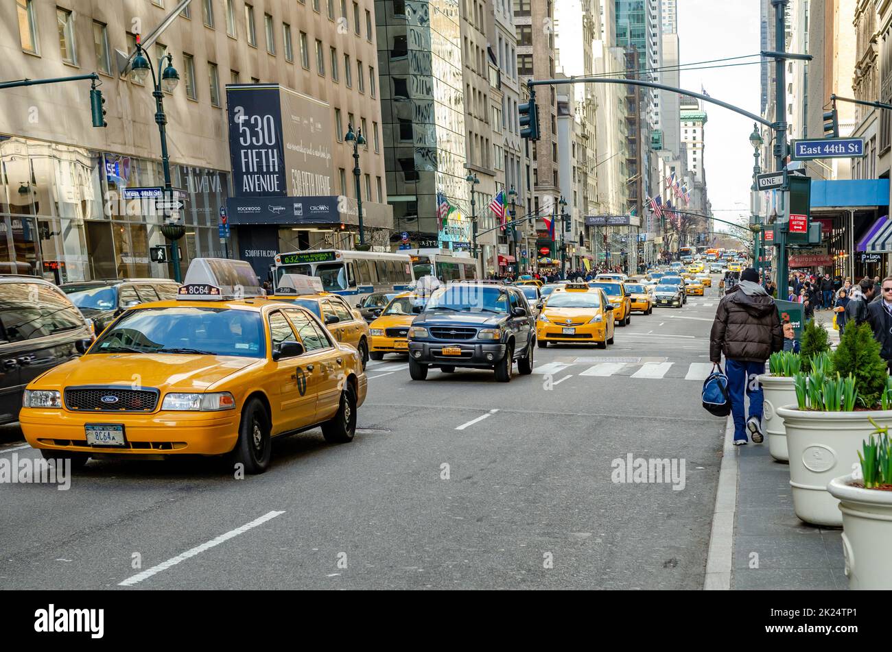 Fifth Avenue Street with lots of Yellow Taxi and cars passing by, lots ...