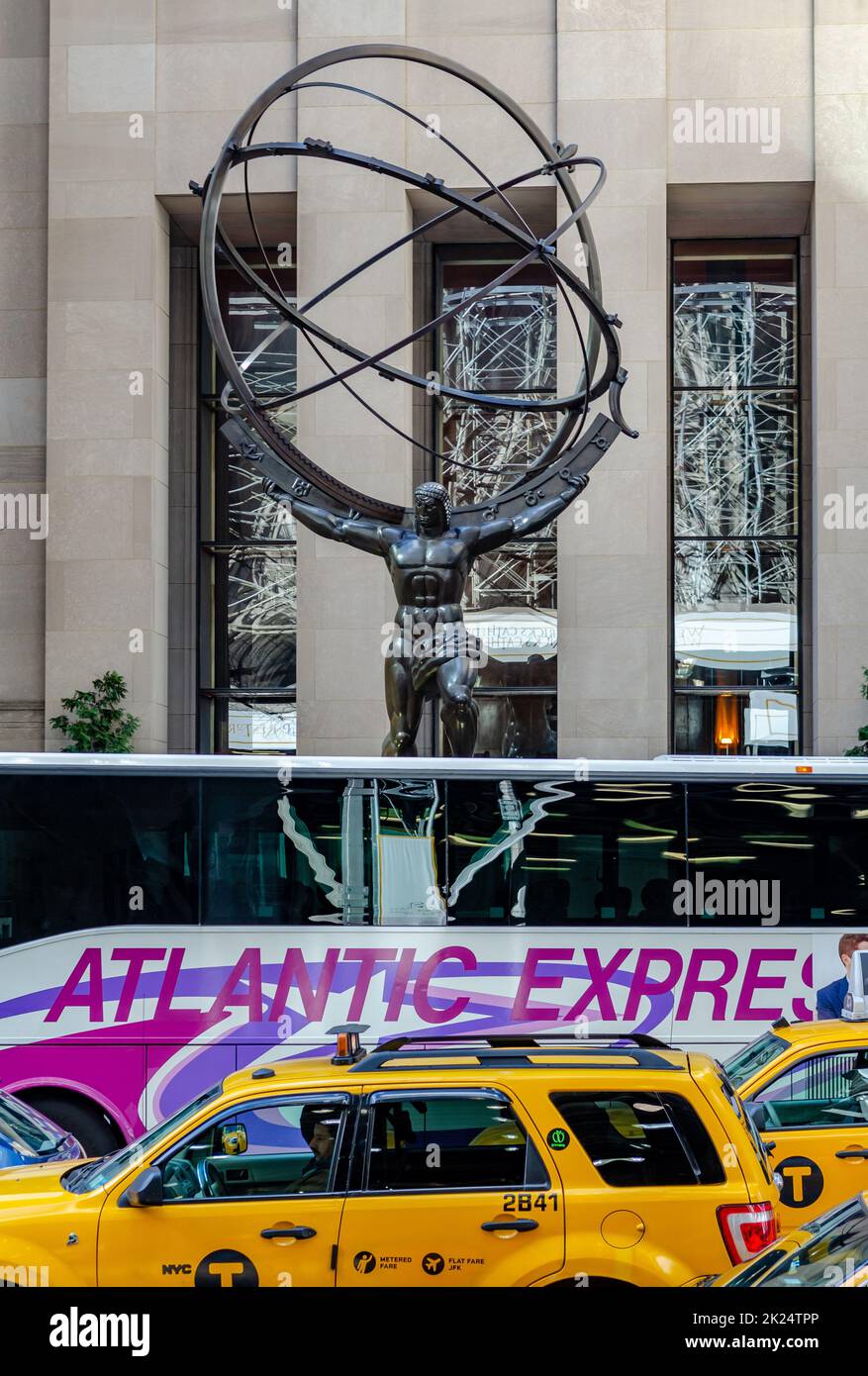 Atlas Statue at Rockefeller Center with Atlantic Express Bus and yellow ...