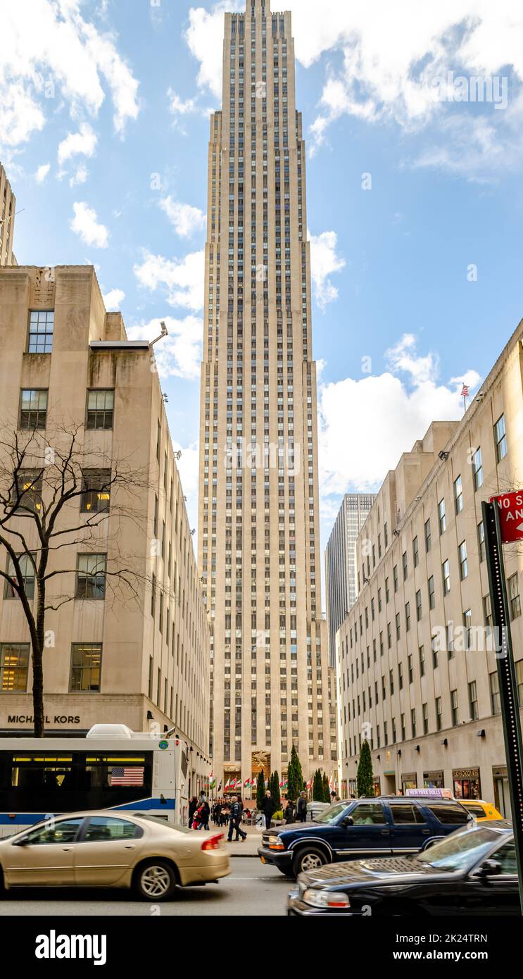 Rockefeller Center with City street and Cars, Bus and Taxi passing by ...