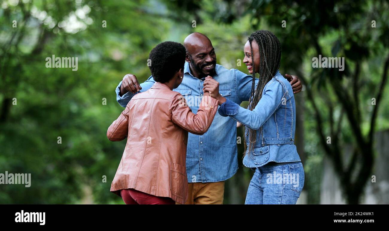 Three people celebrating success uniting group. African ethnicity Stock ...