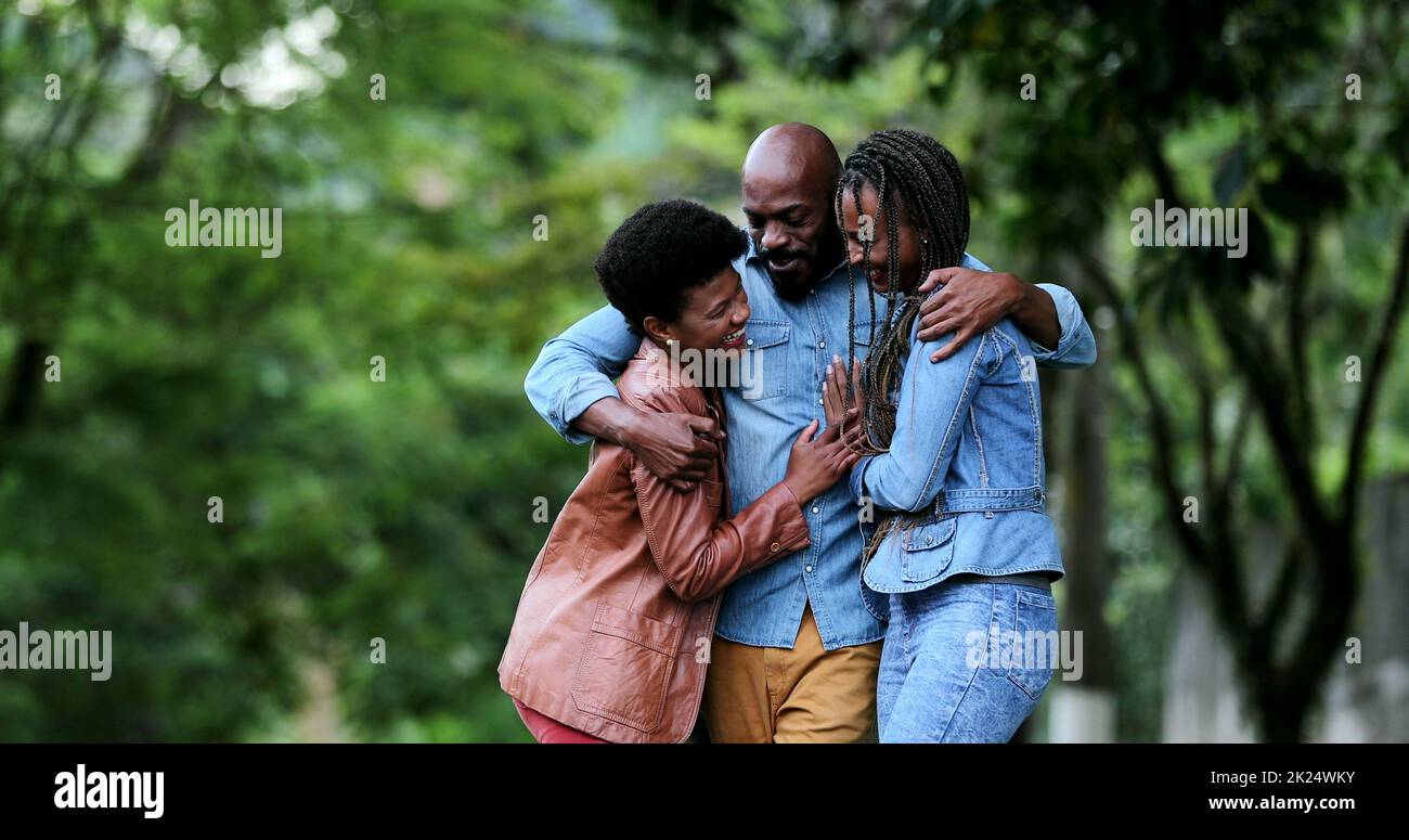 Three people celebrating success uniting group. African ethnicity Stock ...