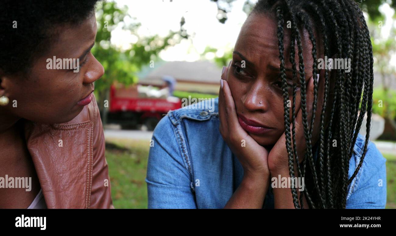 Friend consoling depressed woman, women unity Stock Photo - Alamy