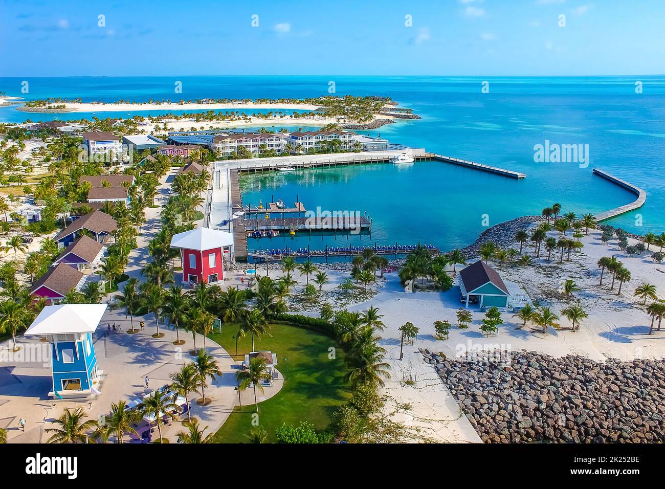 Beach on Ocean Cay Bahamas Island with colorful houses and turquoise ...
