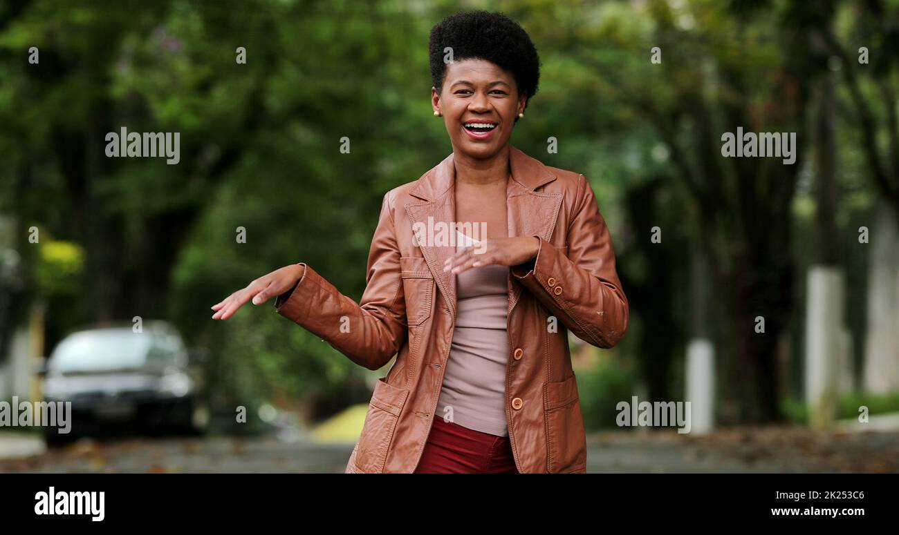 Happy black woman dancing outside. One Groovy African person dance ...