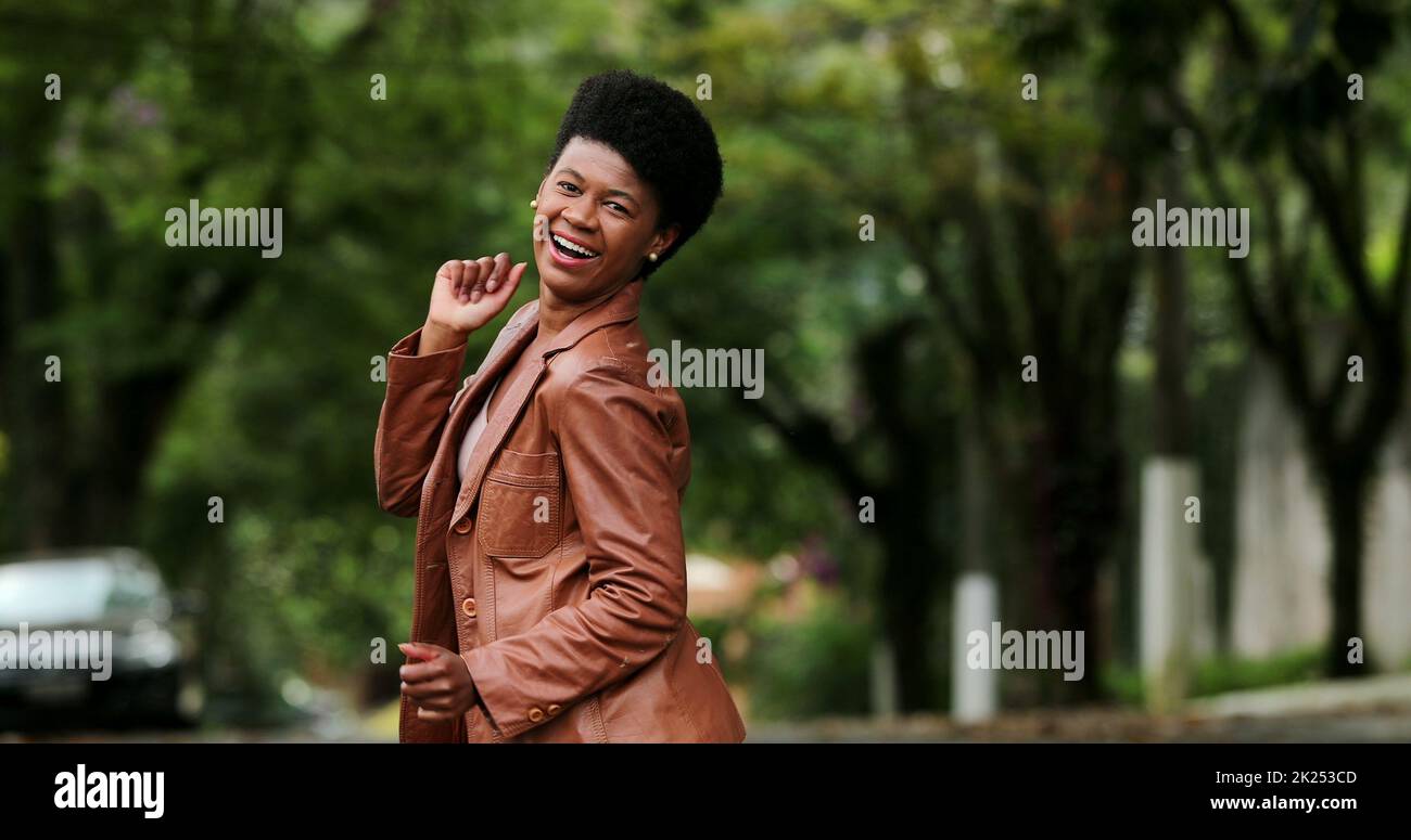 Happy black woman dancing outside. One Groovy African person dance ...