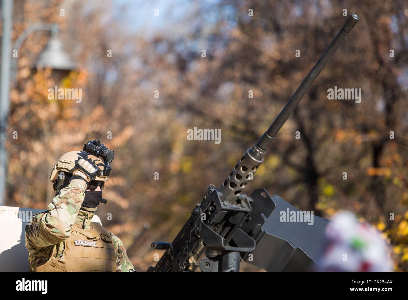 Bucharest, Romania - December 1, 2021: A soldier holds a machine gun on ...