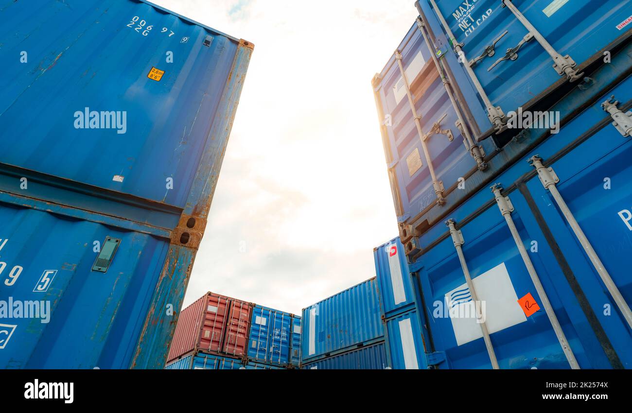 Blue and red logistic container against white sky. Cargo and shipping ...