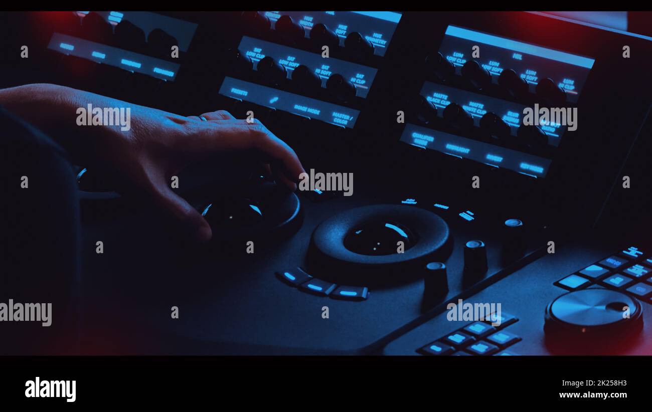 Edit video production control panel in studio. Editor editing and grade ...