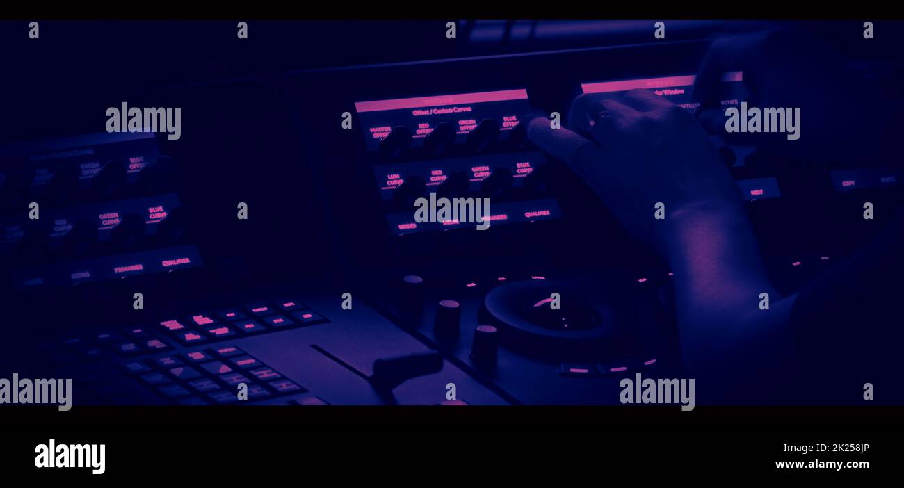 Edit video production control panel in studio. Editor editing and grade ...
