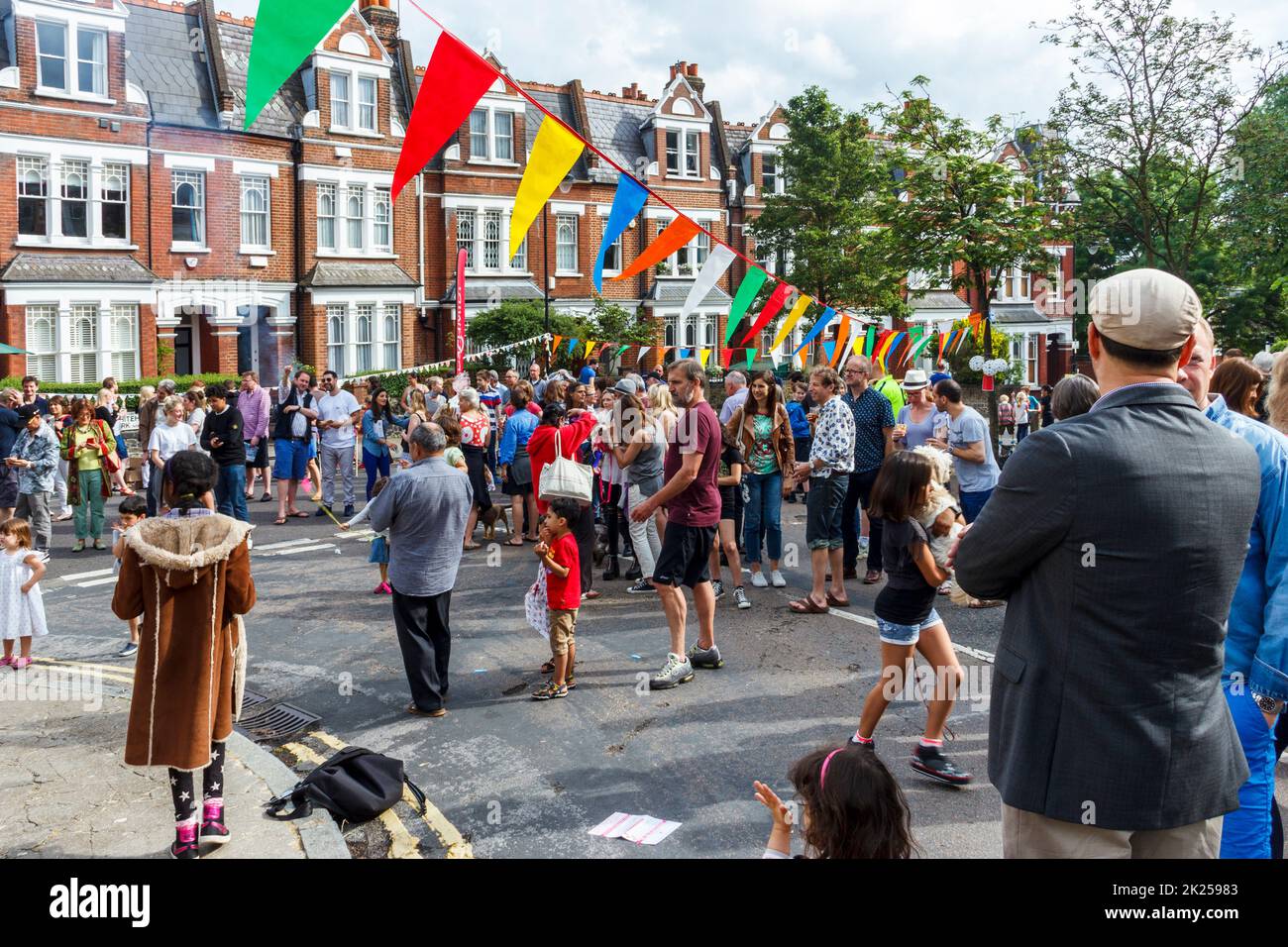 Communal fun and food at a street party celebrating the Queen Elizabeth ...