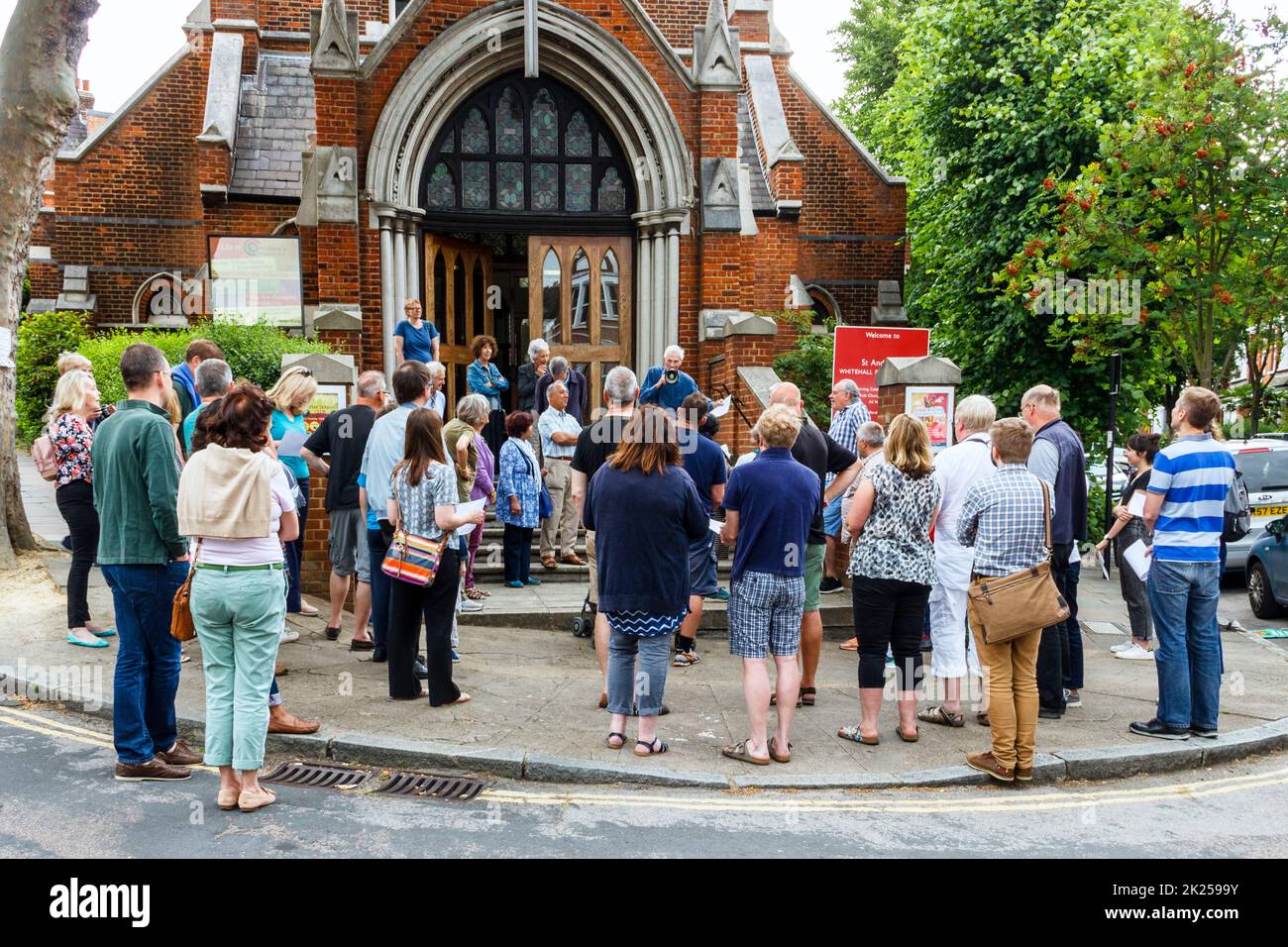 A crowd of people on a guided local history tour in Islington, North ...