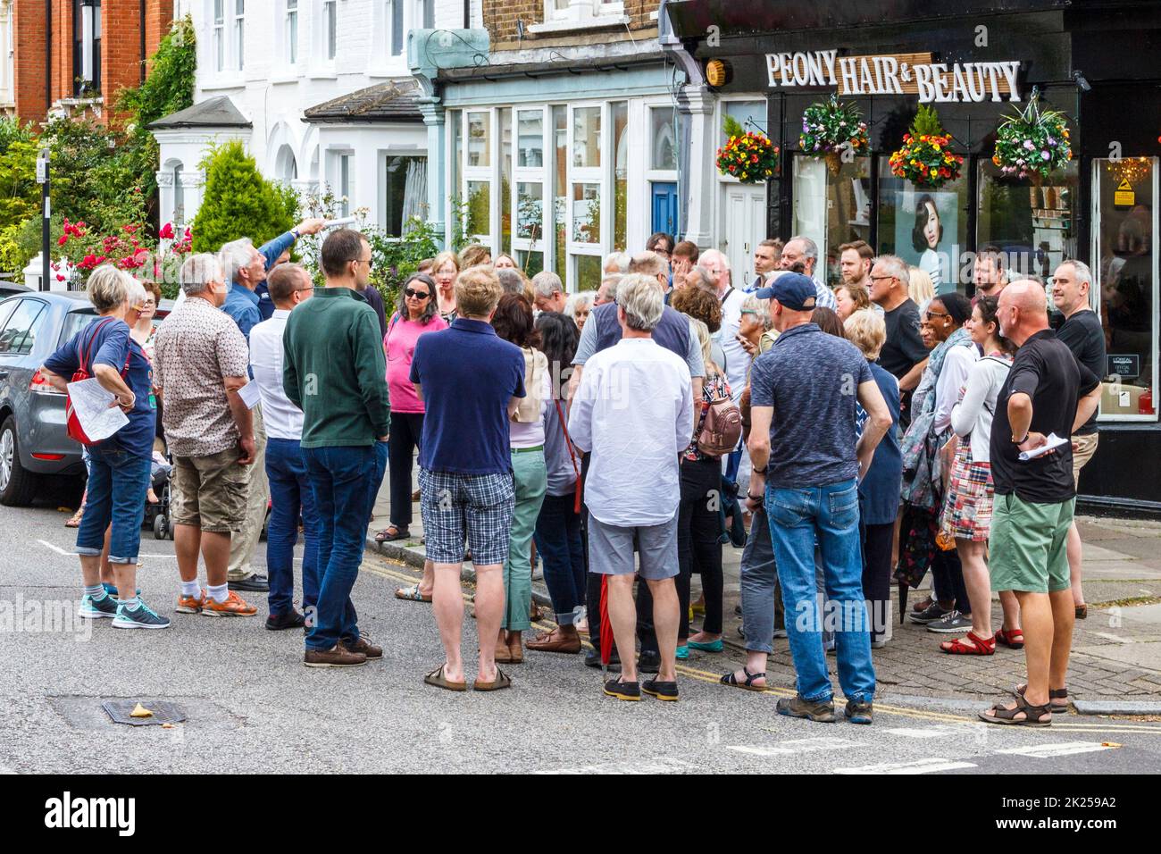 A crowd of people on a guided local history tour in Islington, North ...