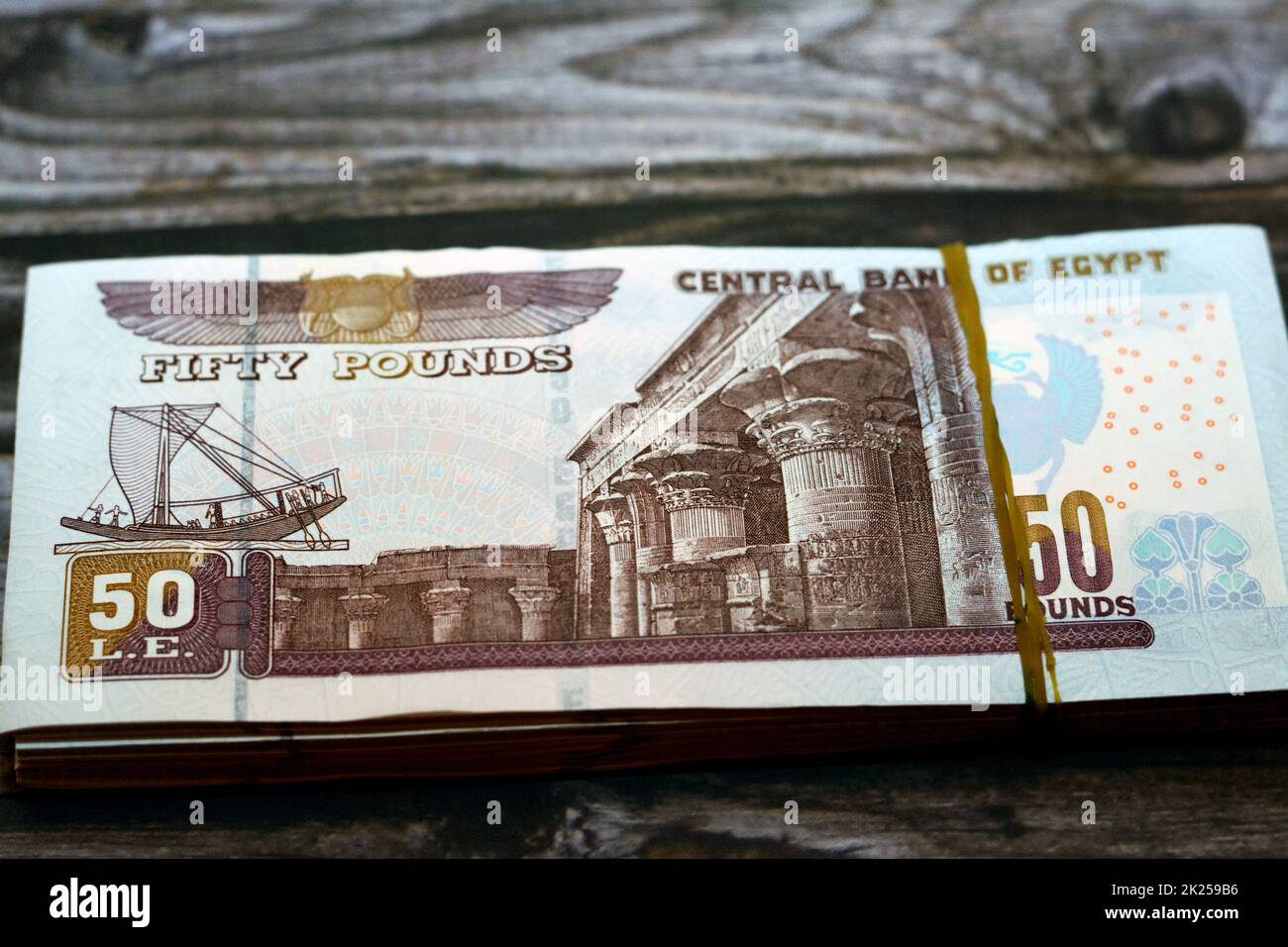 A pile of Egyptian money banknotes of 50 LE fifty pounds series 2022 ...