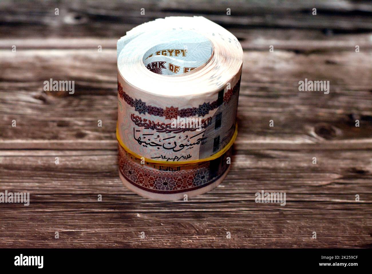 Egypt money roll pounds isolated on wooden background, 50 LE fifty ...