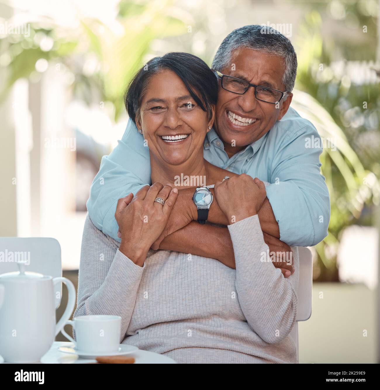 Portrait of elderly couple hug and bonding, happy and enjoying tea ...