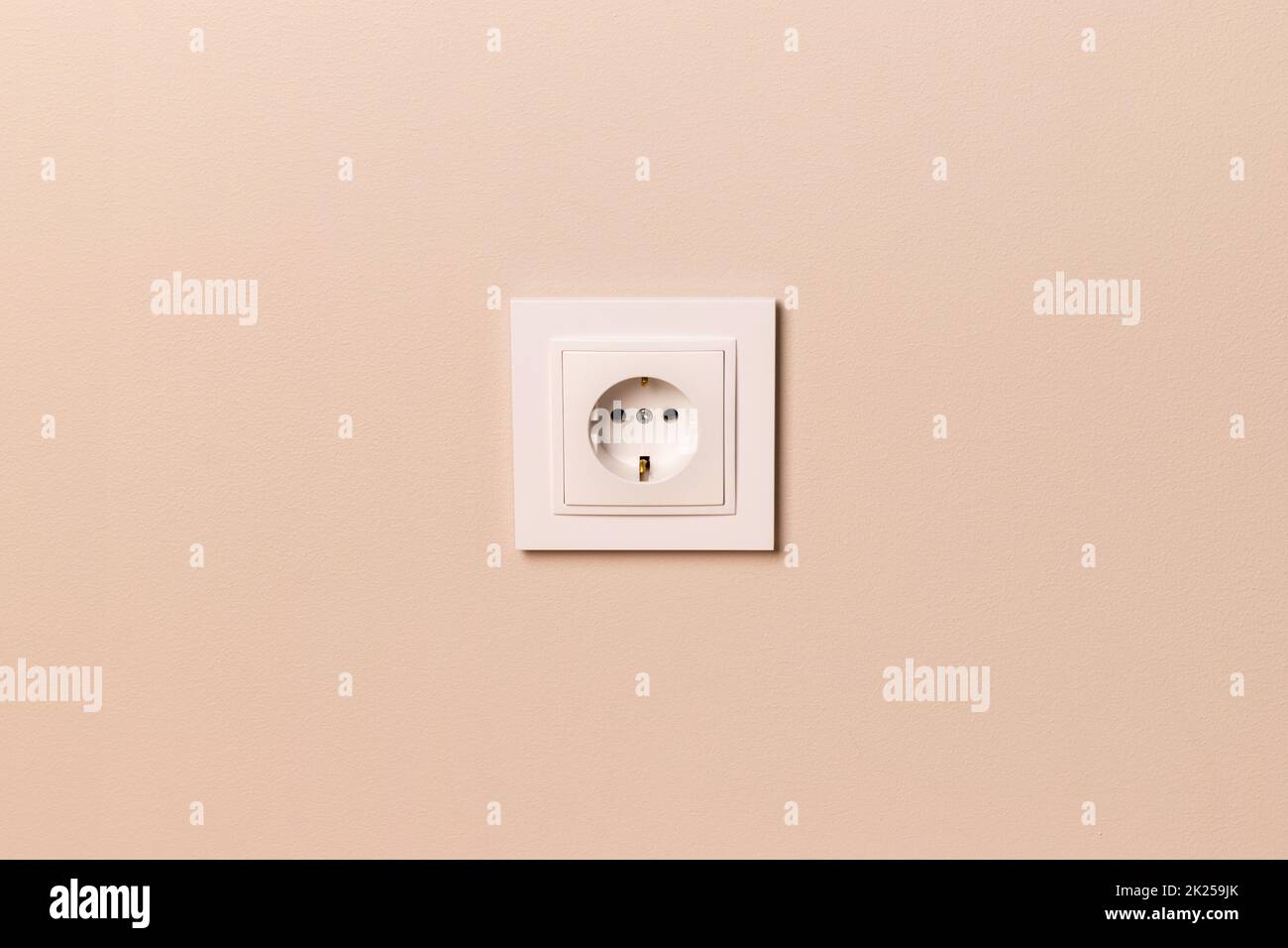 White european electrical outlet on modern beige wall Stock Photo - Alamy