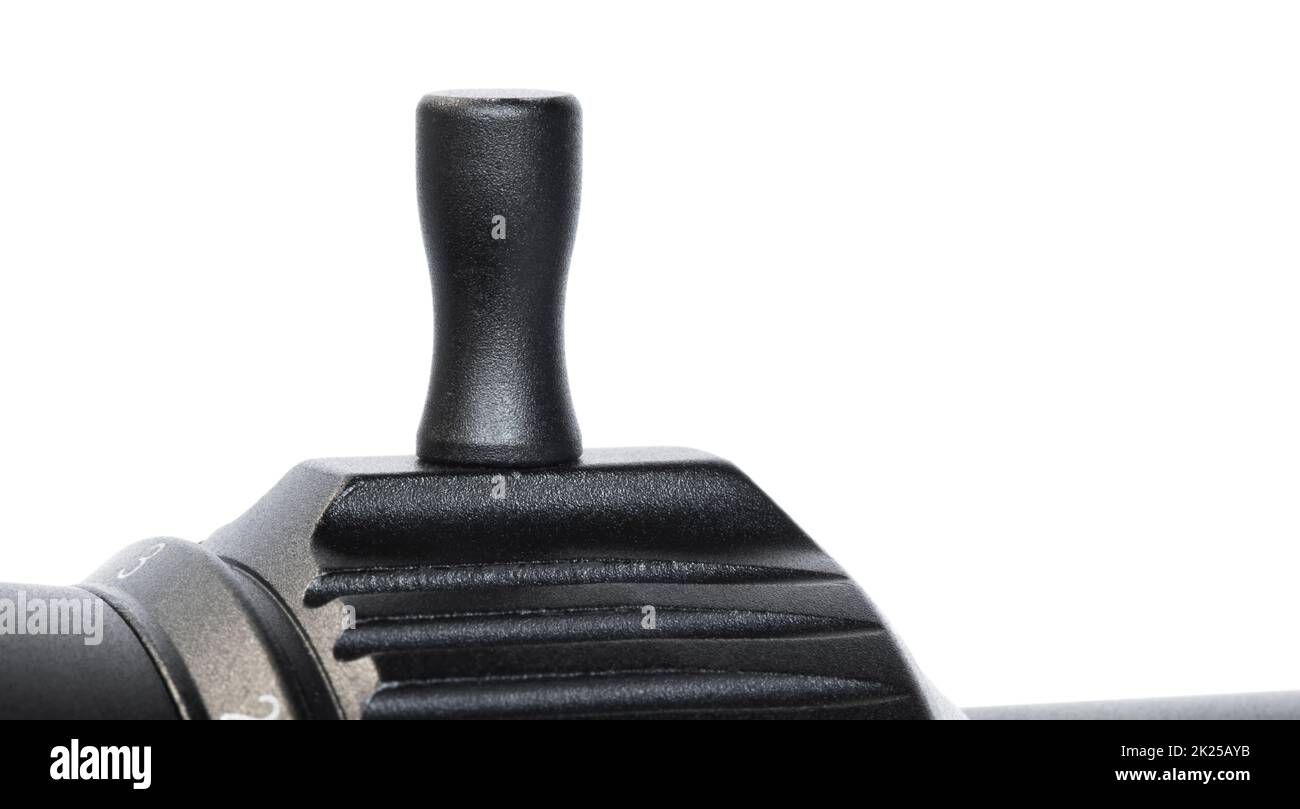 Speed lever on a rifle scope magnification dial isolated on white Stock ...
