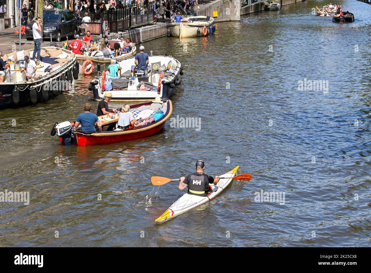 Amsterdam, Netherlands - August 2022: Person paddling a kayak on one of ...