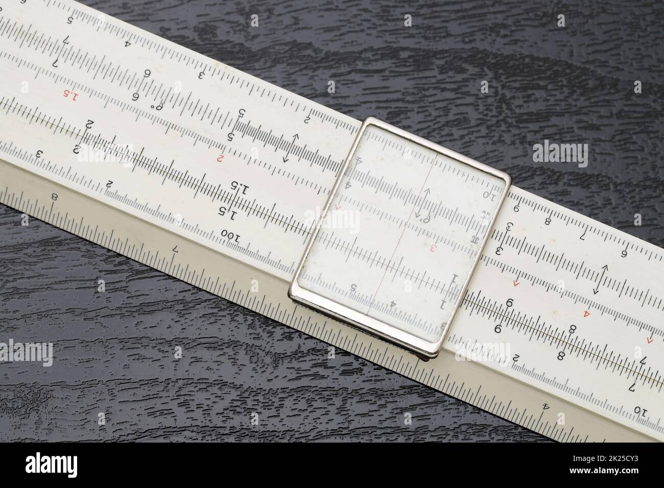 close up of old slide rule on black background Stock Photo - Alamy