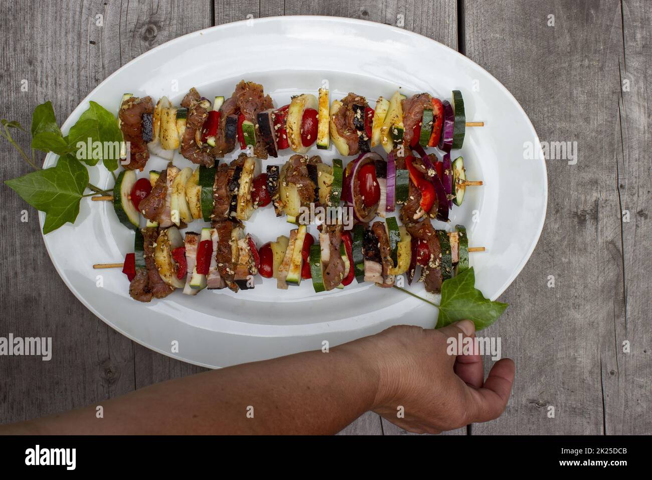 Hand with skewer hi-res stock photography and images - Alamy