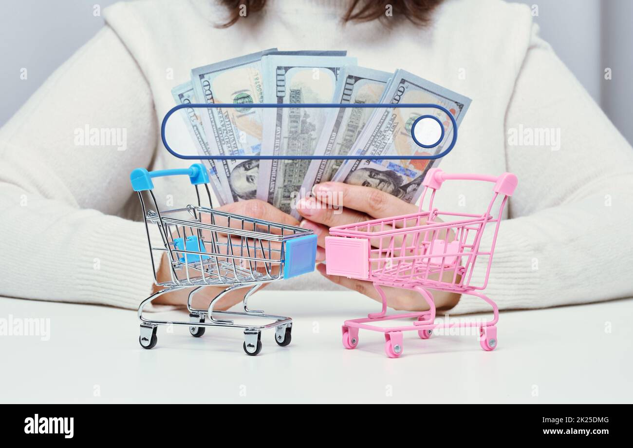 a woman is holding American paper dollars in her hands and two ...