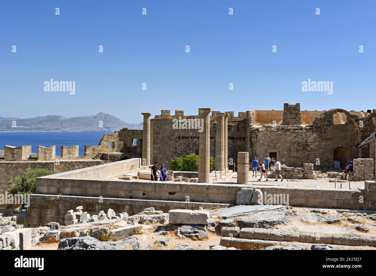 Lindos, Rhodes, Greece - June 2022: People walking over the ruins of ...