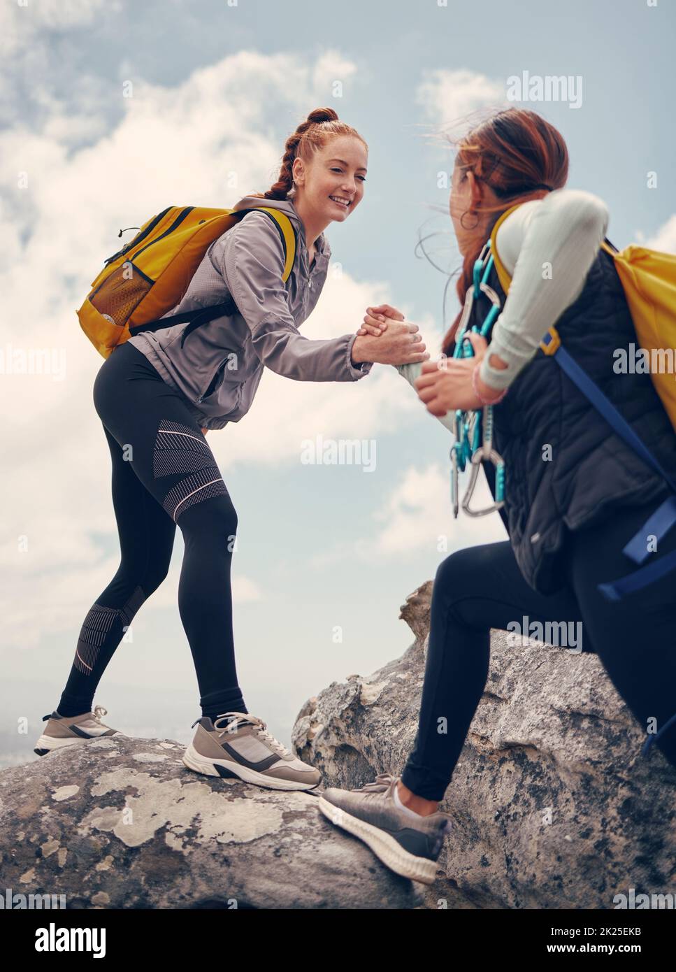 Helping hand mountain climbing hi-res stock photography and images - Alamy