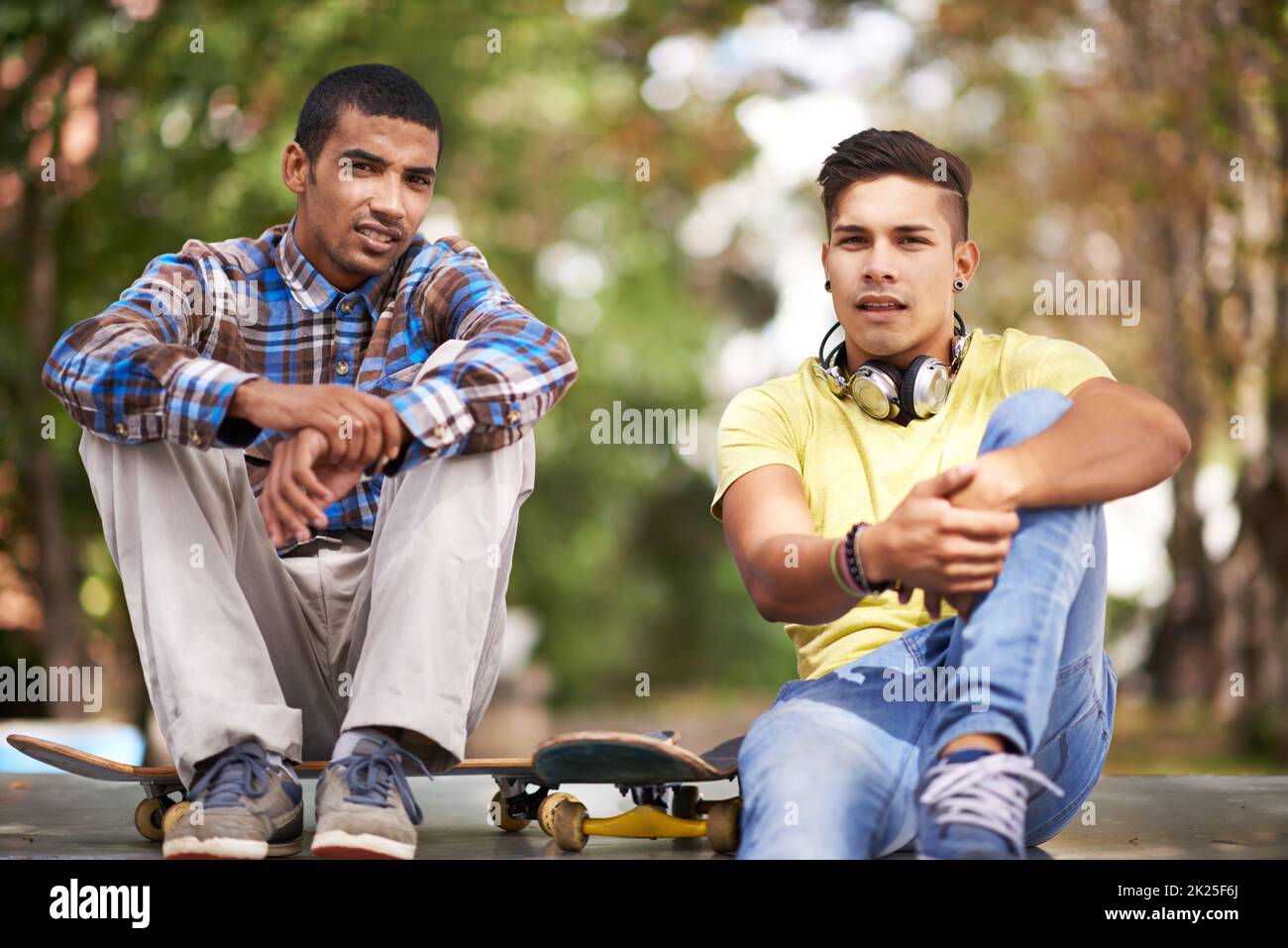Bringing some style to the skate park. Portrait of two young men out ...