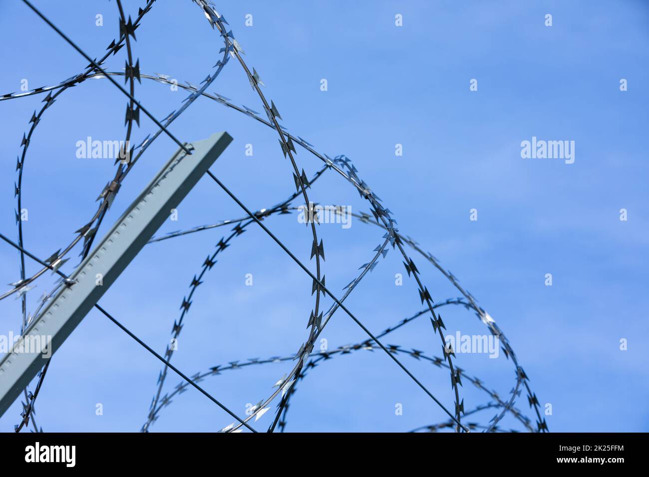 fence detail with barbed wire Stock Photo - Alamy