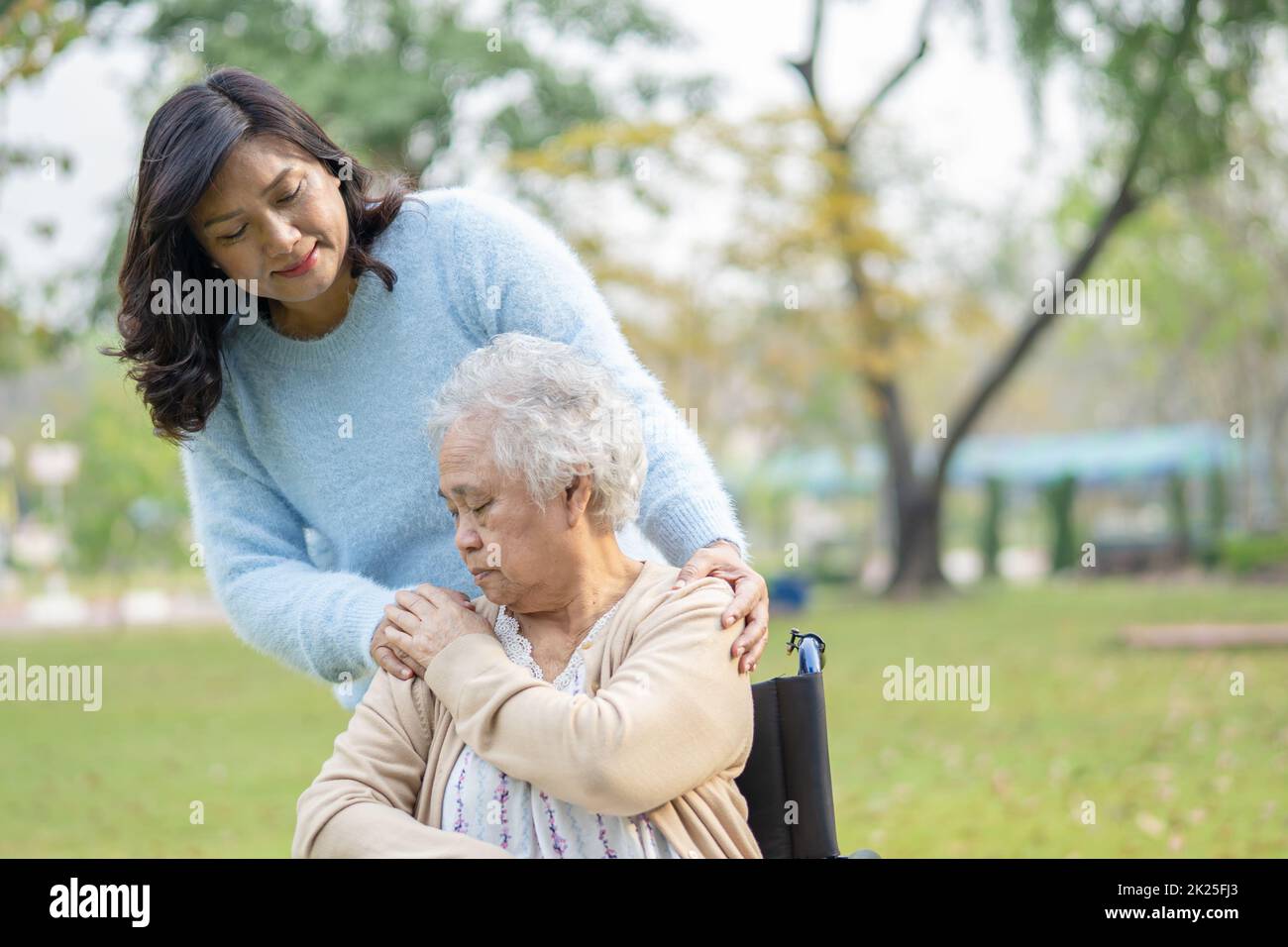 Help and care Asian senior or elderly old lady woman use walker with ...