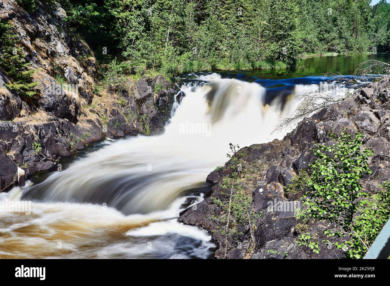 Waterfall on a river in a forest area Stock Photo - Alamy