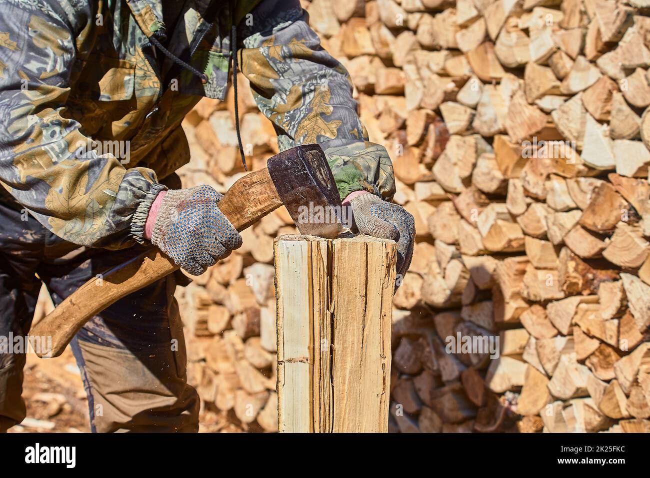 chopping firewood with a chopper close-up on a sunny day Stock Photo ...