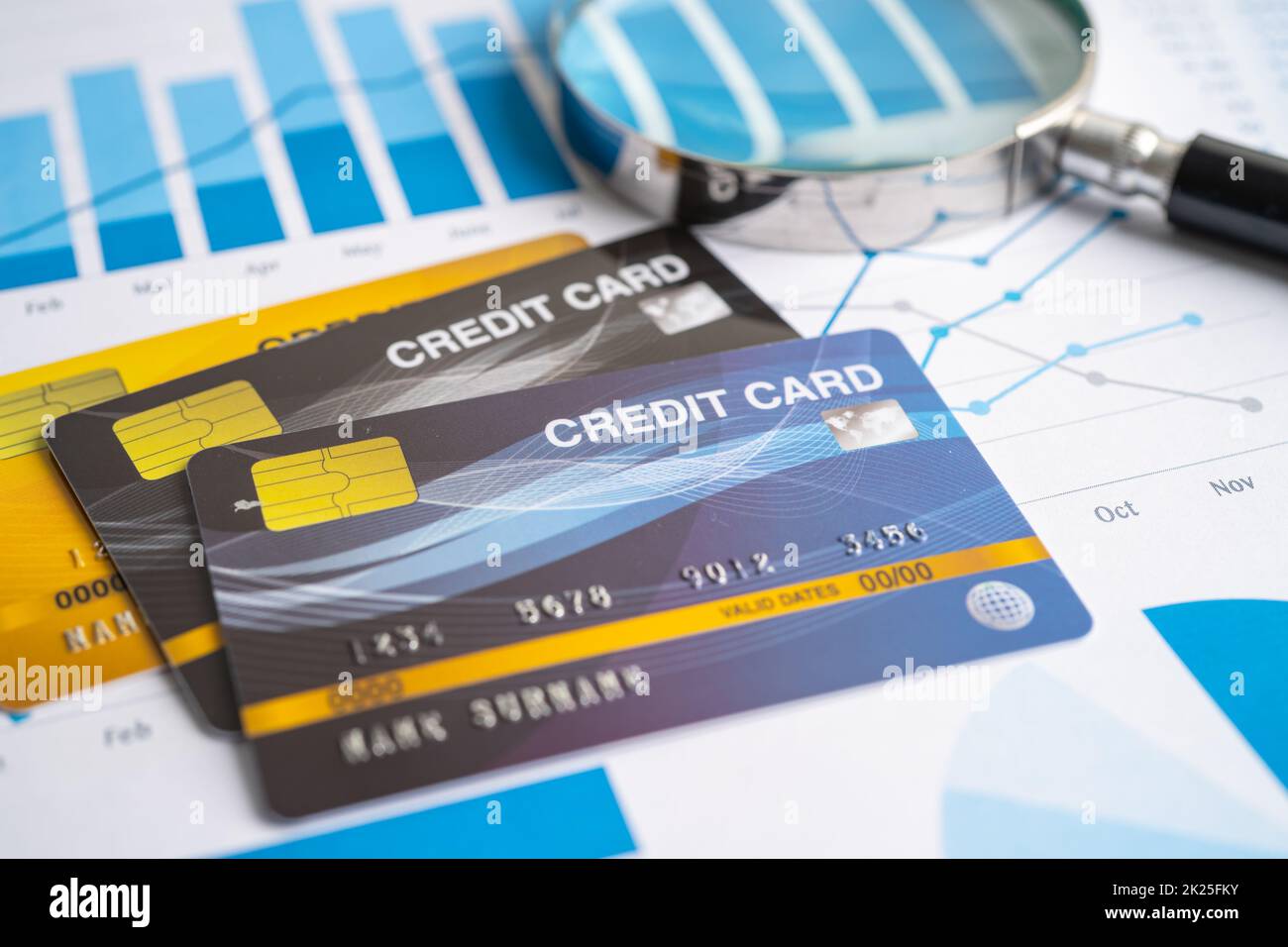 Credit card on chart and graph paper. Finance development, Banking ...