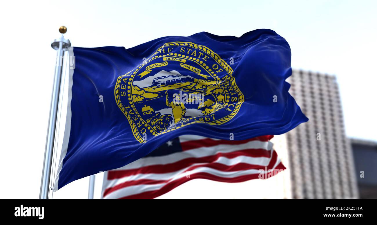 the flag of the US state of Nebraska waving in the wind with the ...