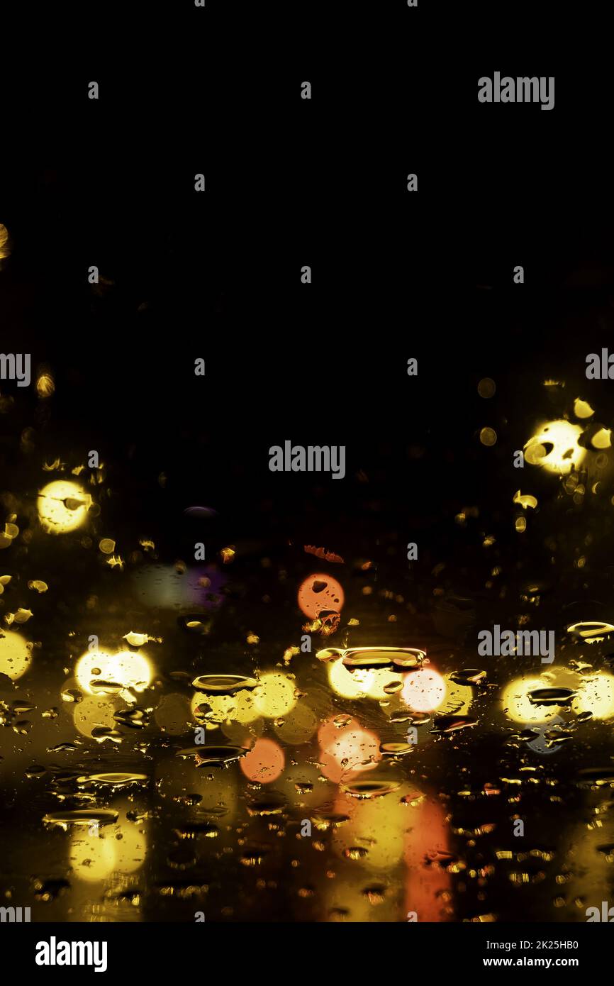 Wet glass with night lights Stock Photo - Alamy