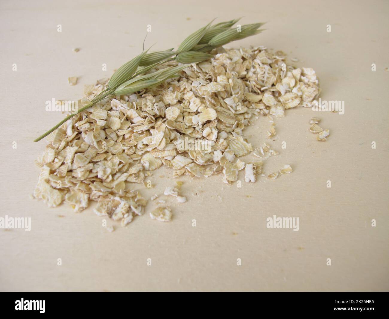 Fine rolled oats flakes on a wooden board Stock Photo - Alamy