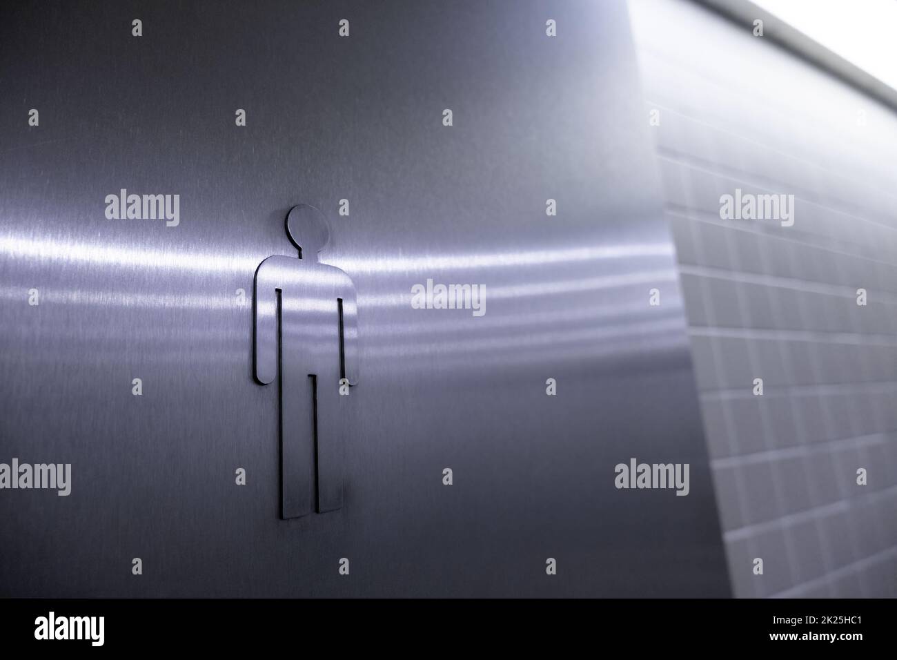 Man sign in toilet Stock Photo - Alamy