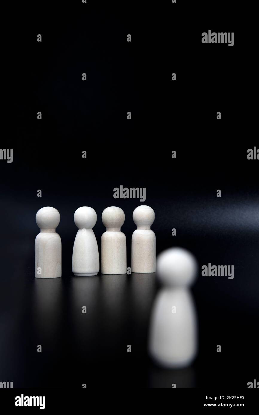 One child figure standing outside the group being excluded. Concept ...