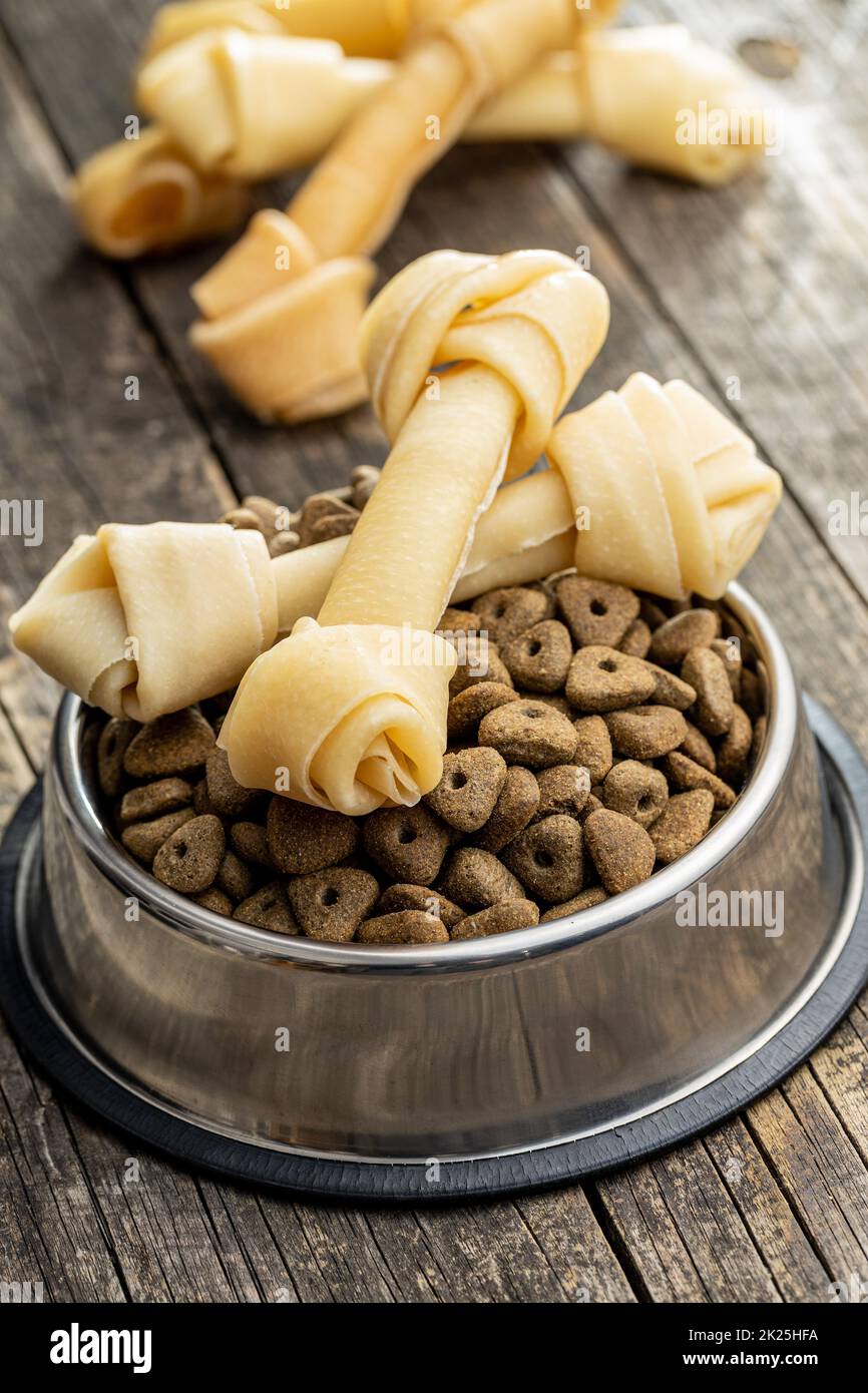 Delicacy for dogs. Chewing bone and dried food for dog Stock Photo - Alamy