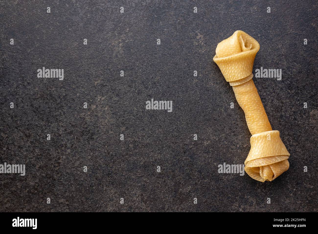 Delicacy for dogs. Chewing bone for dog Stock Photo - Alamy