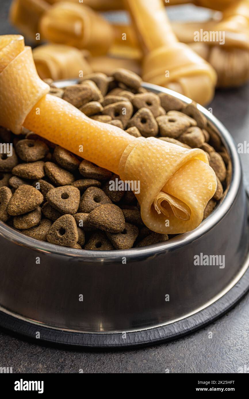 Delicacy for dogs. Chewing bone and dried food for dog Stock Photo - Alamy