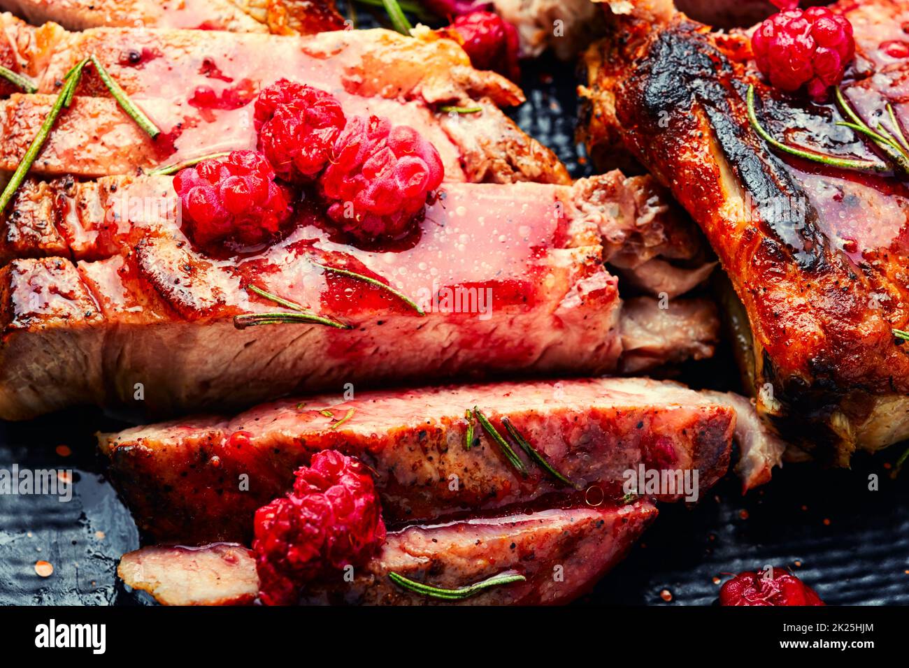 Pork steak with berry sauce Stock Photo - Alamy