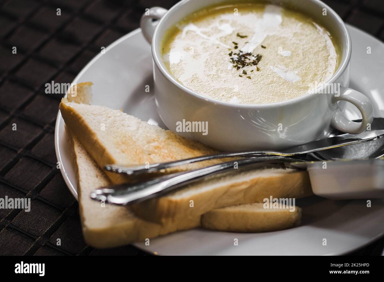 Cream of mushroom soup with garlic bread for bedfast meal in morning ...