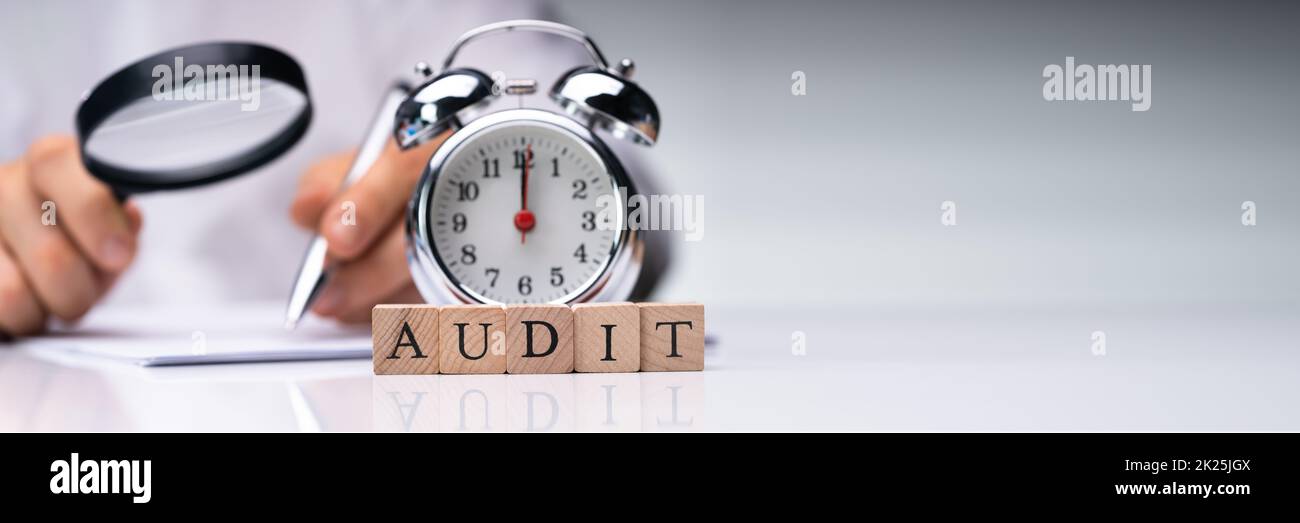Audit And Fraud Investigation. Auditor Using Magnifying Glass Stock ...