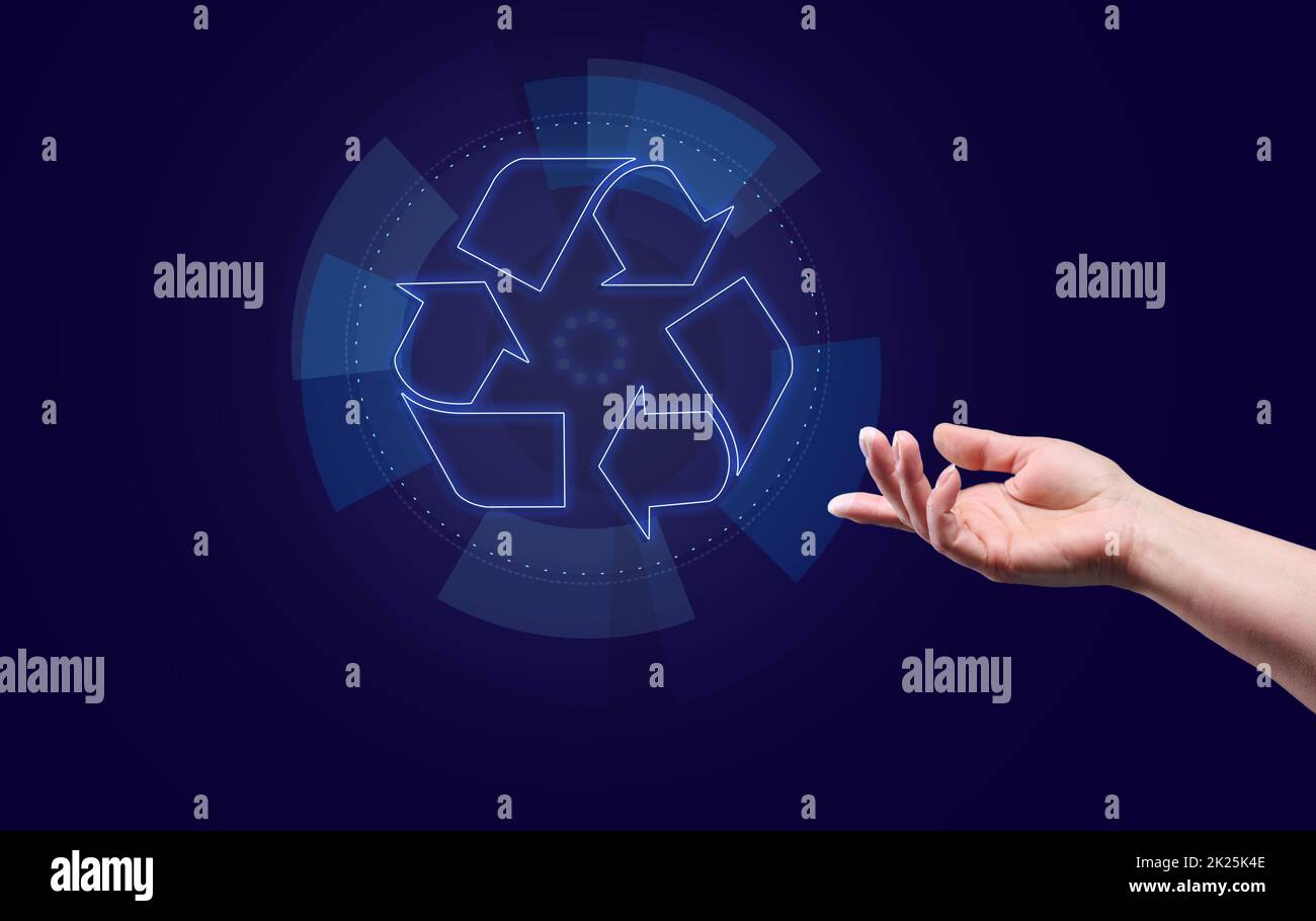 Blue glowing recycling sign floating above hand Stock Photo - Alamy