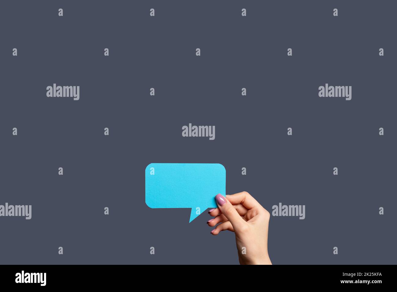 Dialogue icon. Blank speech bubble. Online communication. Female hand ...