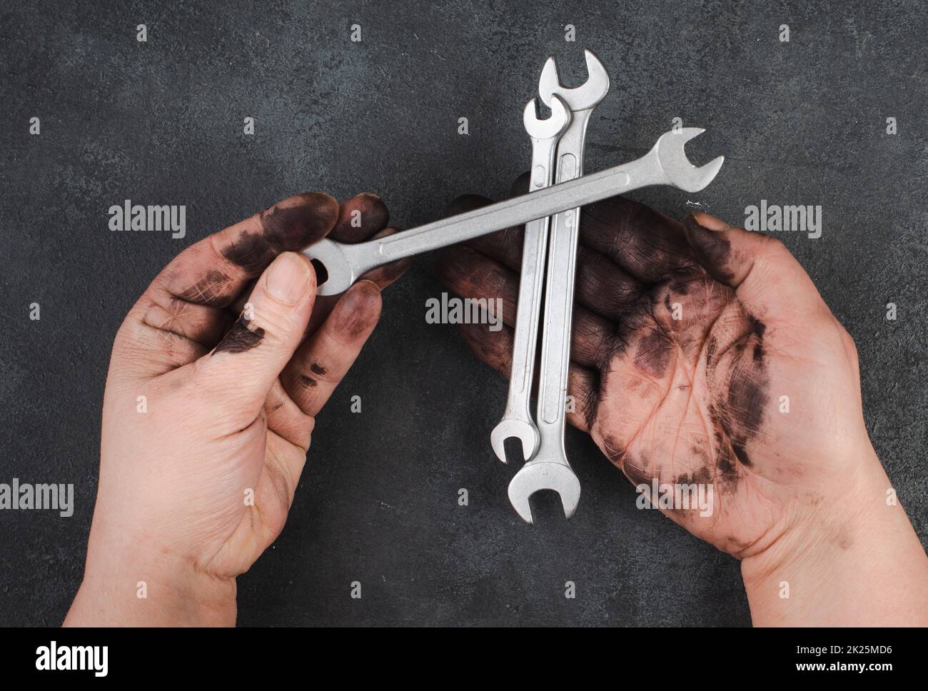 Oil covered hand holding wrench hi-res stock photography and images - Alamy